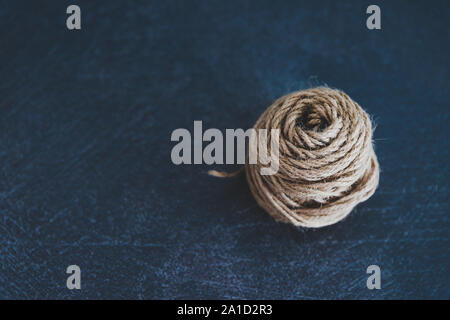 tangled ball of thread with string popping out of it, metaphor of ...
