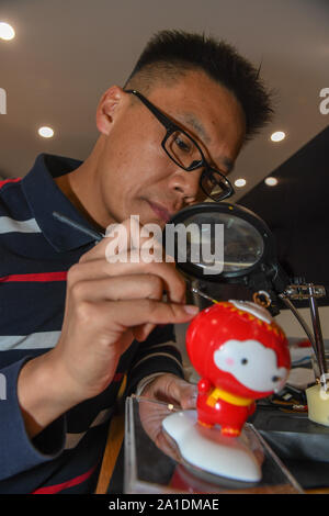 (190926) -- CHANGCHUN, Sept. 26, 2019 (Xinhua) -- Designer Jiang Yufan ...