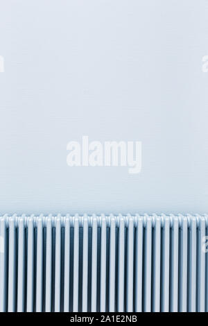 Modern radiator in room. Central heating system Stock Photo - Alamy