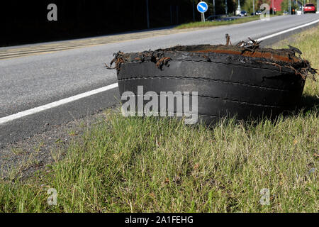 Exploded tire of semi truck on highway roadside Stock Photo - Alamy