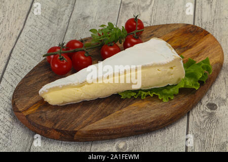 Brie cheese triangle served salad leaves Stock Photo - Alamy