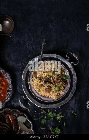 Traditional pilaf, rice with vegetables and fresh Basil in a plate on a ...
