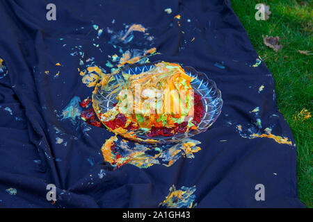 Mangled colourful iced cake after a child's first birthday party cake ...