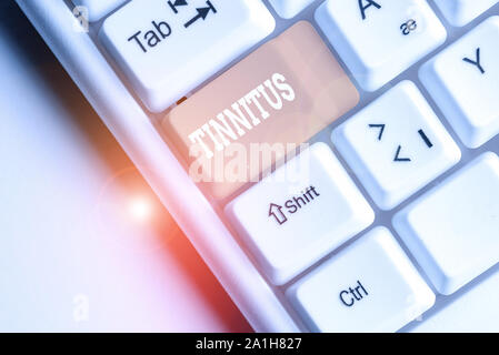Writing note showing Tinnitus. Business photo showcasing A ringing or ...