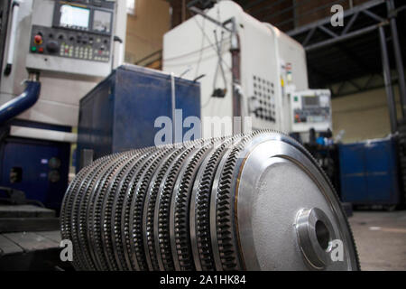 stacked steel pulleys inside factory Stock Photo - Alamy