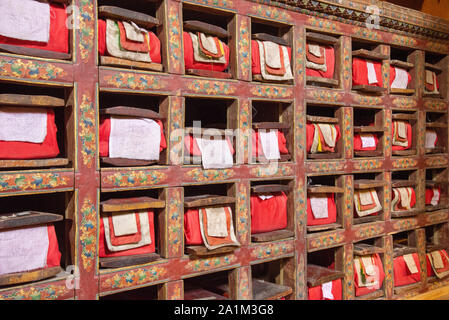 shelves with old prayer books in palace of Leh in Ladakh, India Stock ...