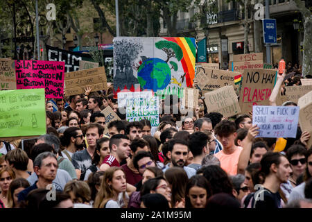 People with banners protest as part of a climate change march Stock ...