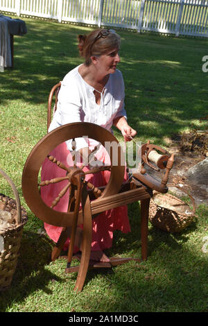 A demonstration of how a spinning wheel was used in colonial times ...