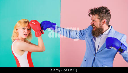 Gender battle. Gender equal rights. Family quarrel. Boxers fighting in ...