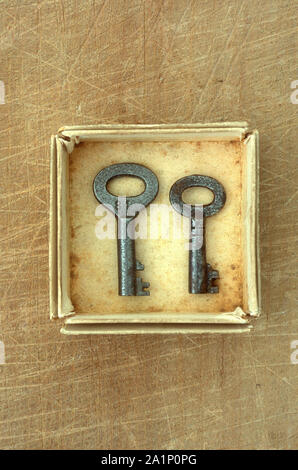 Small cardboard box containing vintage used silver key Stock Photo - Alamy