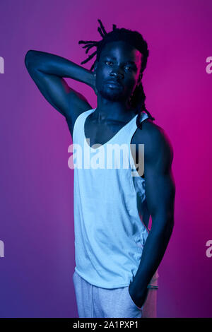 Portrait of handsome cheerful guy demonstrating copy space showing call ...