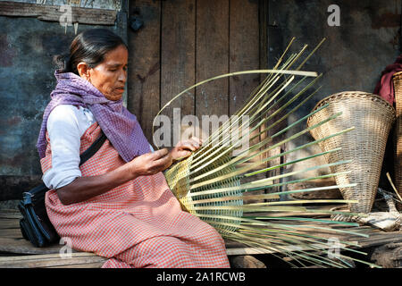 Woman is weaving basket of bamboo. Village Khrang, Khasi-Hills, state ...