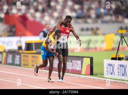 Braima SUNCAR DABO r. (Guinea-Bissau) helps Jonathan BUSBY (Aruba ...