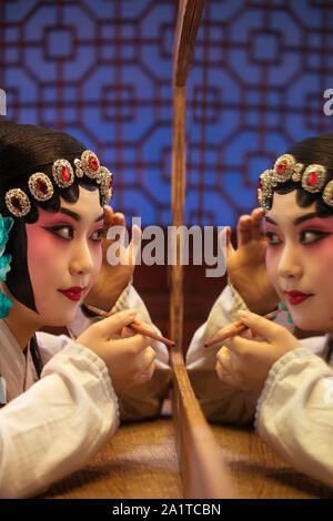 Female Peking Opera actor backstage makeup Stock Photo - Alamy