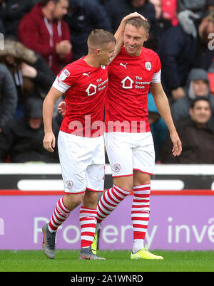 Barnsley's Cauley Woodrow (right) celebrates scoring their first goal ...