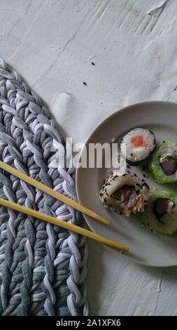 Salmon and caviar rolls served on a plate Stock Photo - Alamy
