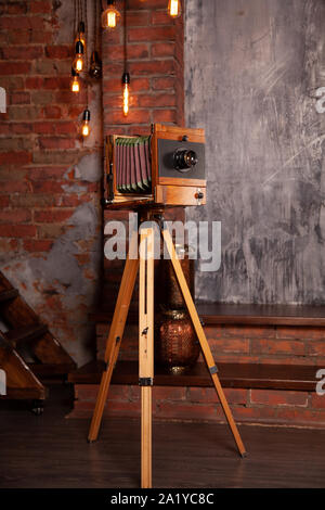 Large format retro camera, 5x7 inches. Photographer holds in hand old ...