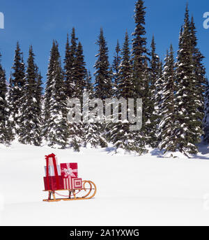 Christmas gifts and snow background Stock Photo - Alamy