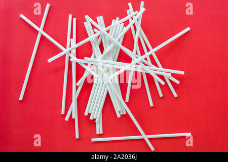 Red eco-friendly paper straw on light blue background Stock Photo - Alamy