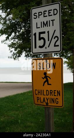 children playing sign and speed limit sign Italy Europe Stock Photo - Alamy