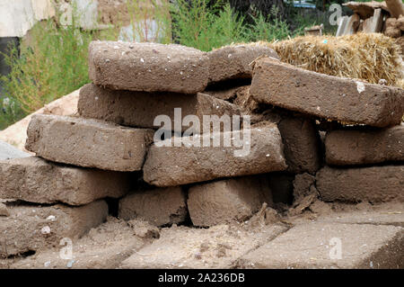 Adobe bricks and the straw used to make them at a semi abandoned ...