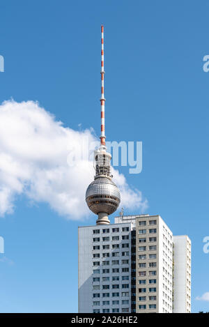 Television tower against the blue sky with clouds Stock Photo - Alamy