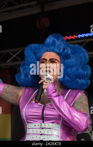 Drag artist stage name "Shagger" with a huge blue wig and eccentric ...