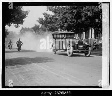 Police on motorcycle trailing car with smoke ca. 1923 Stock Photo - Alamy