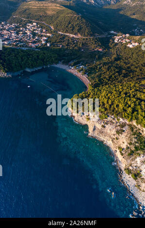 Aerial view of sandy beach with umbrellas and gazebos.Summer vacation ...