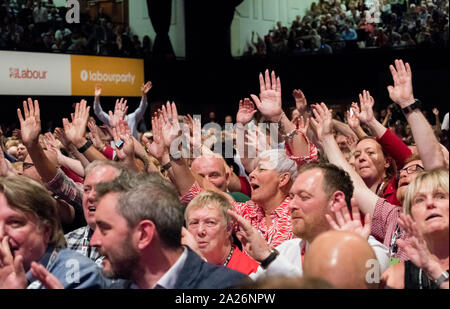 Labour Party Members and delegates cheering, clapping and giving a ...
