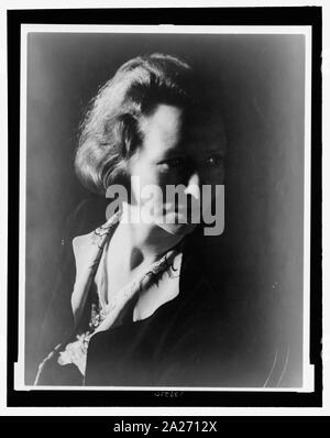 Edna St. Vincent Millay (1892-1950) American poet, seated behind NBC ...
