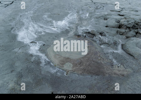 Bubbling crater of a mud volcano. Close up view onto gas bubble ...