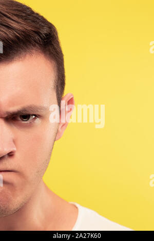 So serious. Mans portrait yellow background. Portrait of guy with ...