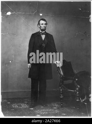 President Abraham Lincoln, full-length portrait, seated and facing ...