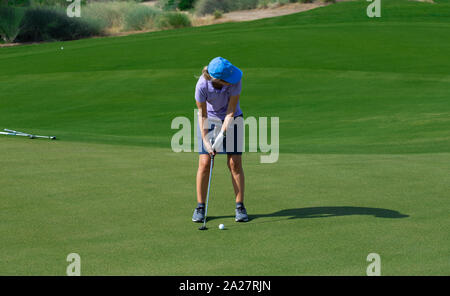 Golfers hit sweeping golf course in the summer. The game of Golf Stock ...