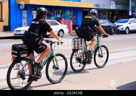 Two Police officers riding bicycles patrolling in St James's Park by ...