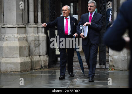 Sir Frederick Barclay (left) leaves the High Court in London, follow a ...