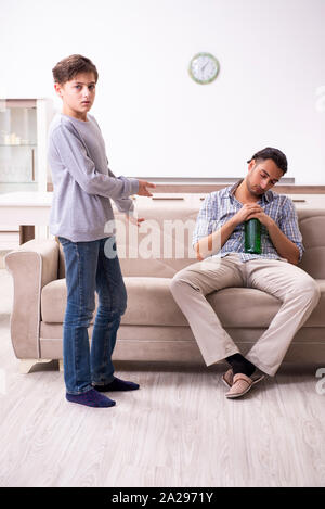 Drunk father and his son Stock Photo - Alamy