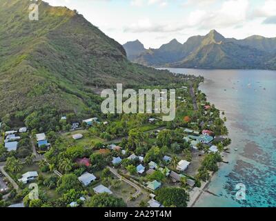 Aerial view of Moorea Island in French Polynesia swimming between blue ...