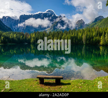 A breathtaking view of the Julian Alps in Slovenia showcases lush green ...