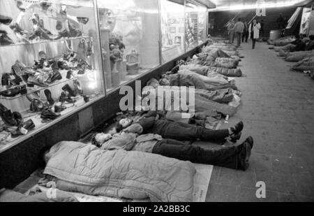 Homeless people sleeping in the mezzanine floor at the Munich Main ...