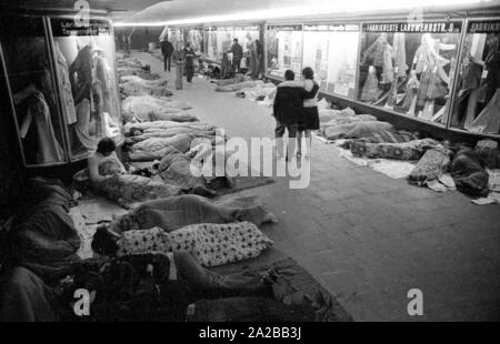 Homeless people sleeping in the mezzanine floor at the Munich Main ...