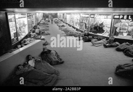 Homeless people sleeping in the mezzanine floor at the Munich Main ...
