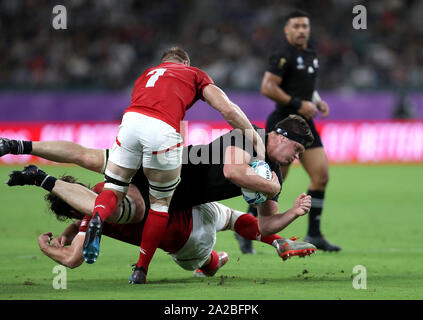 New Zealand's Scott Barrett is tackled by Canada's Matt Heaton (left ...