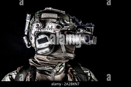 Modern combatant wearing night vision device black background Stock ...