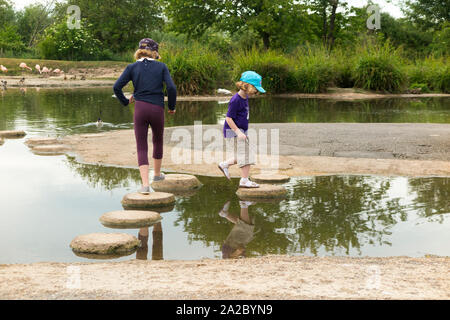 Child on step stone / children / kids / kids play on stepping stones ...