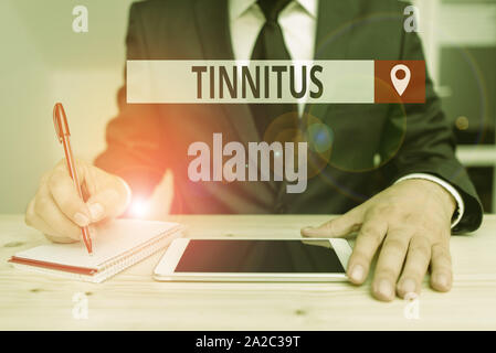 Writing note showing Tinnitus. Business photo showcasing A ringing or ...