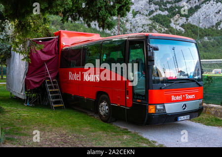Huge red Mercedes bus, Rotel Tours, in the Italian Dolomites, Canazei ...