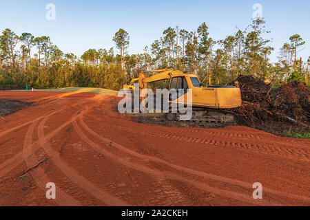 Heavy earth moving equipment clearing the ground for a large scale ...
