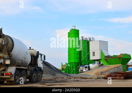 Concrete truck load concrete to bucket and mobile crain liftting pour ...
